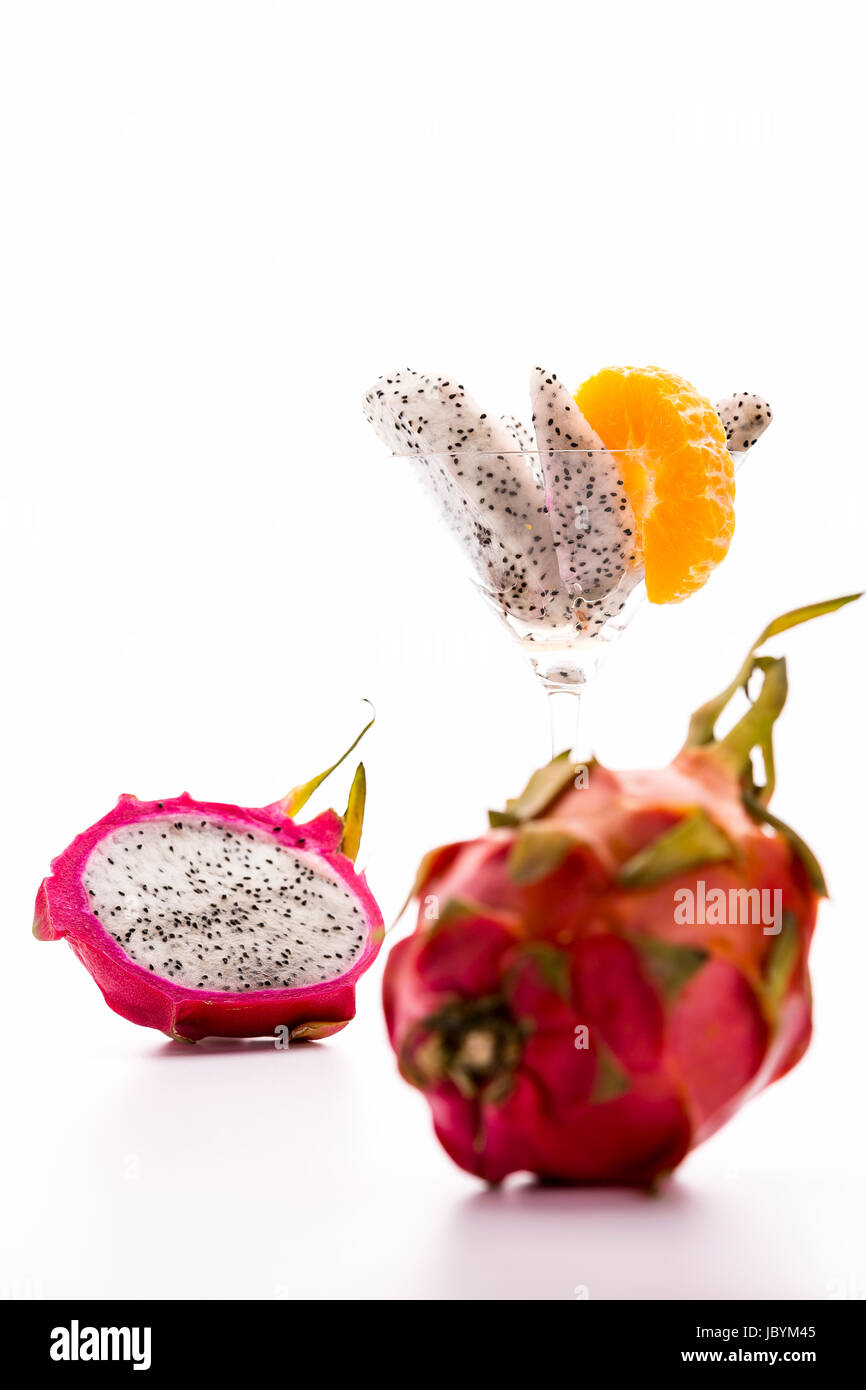 The slightly leafy rind and vibrant purple color of the pitaya is ...