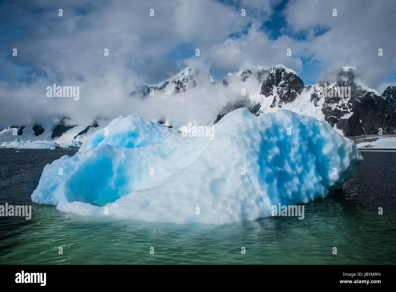 Blue shimmering beautiful iceberg in Antarctica Stock Photo - Alamy