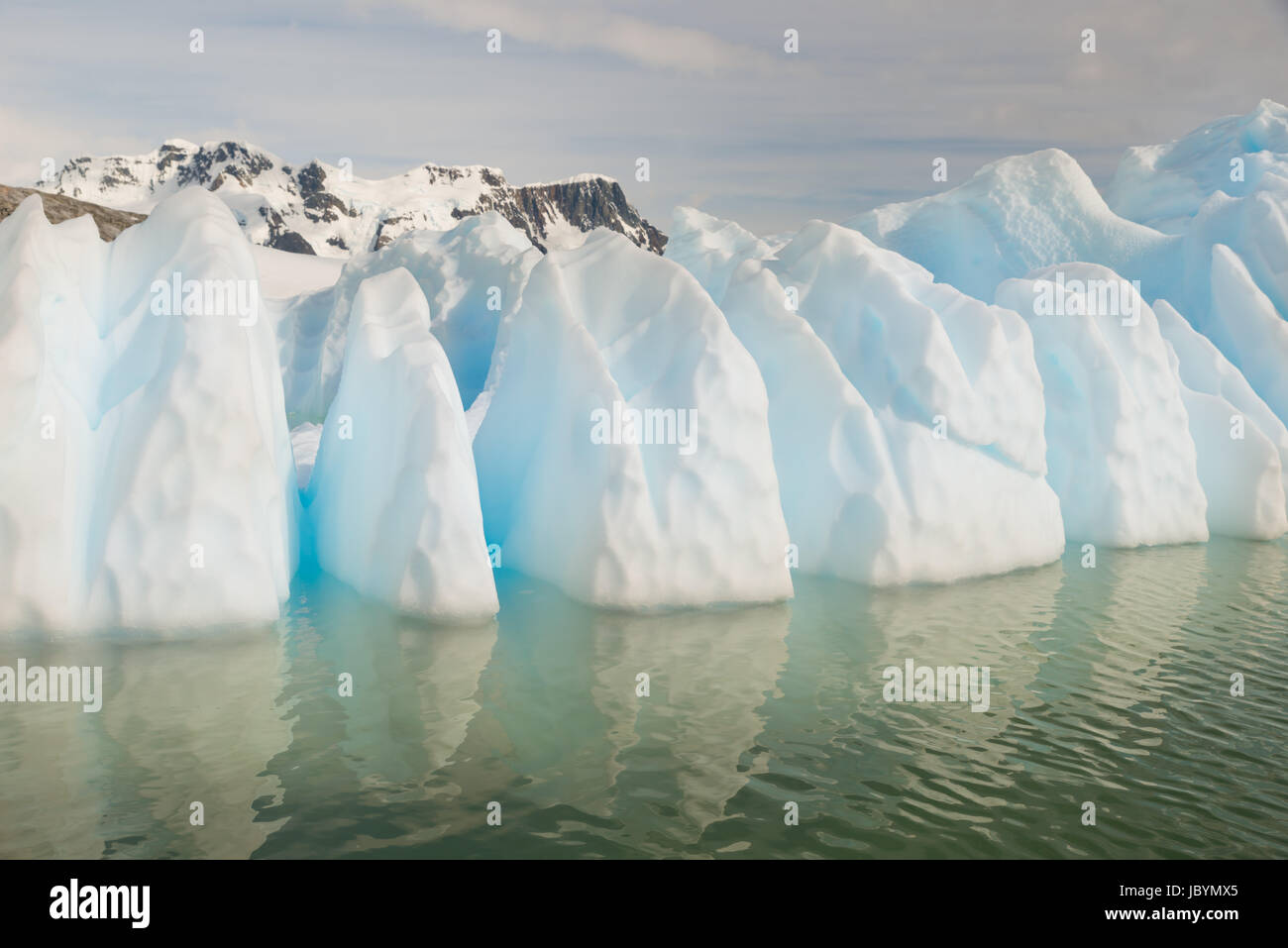 Blue shimmering beautiful iceberg in Antarctica Stock Photo - Alamy