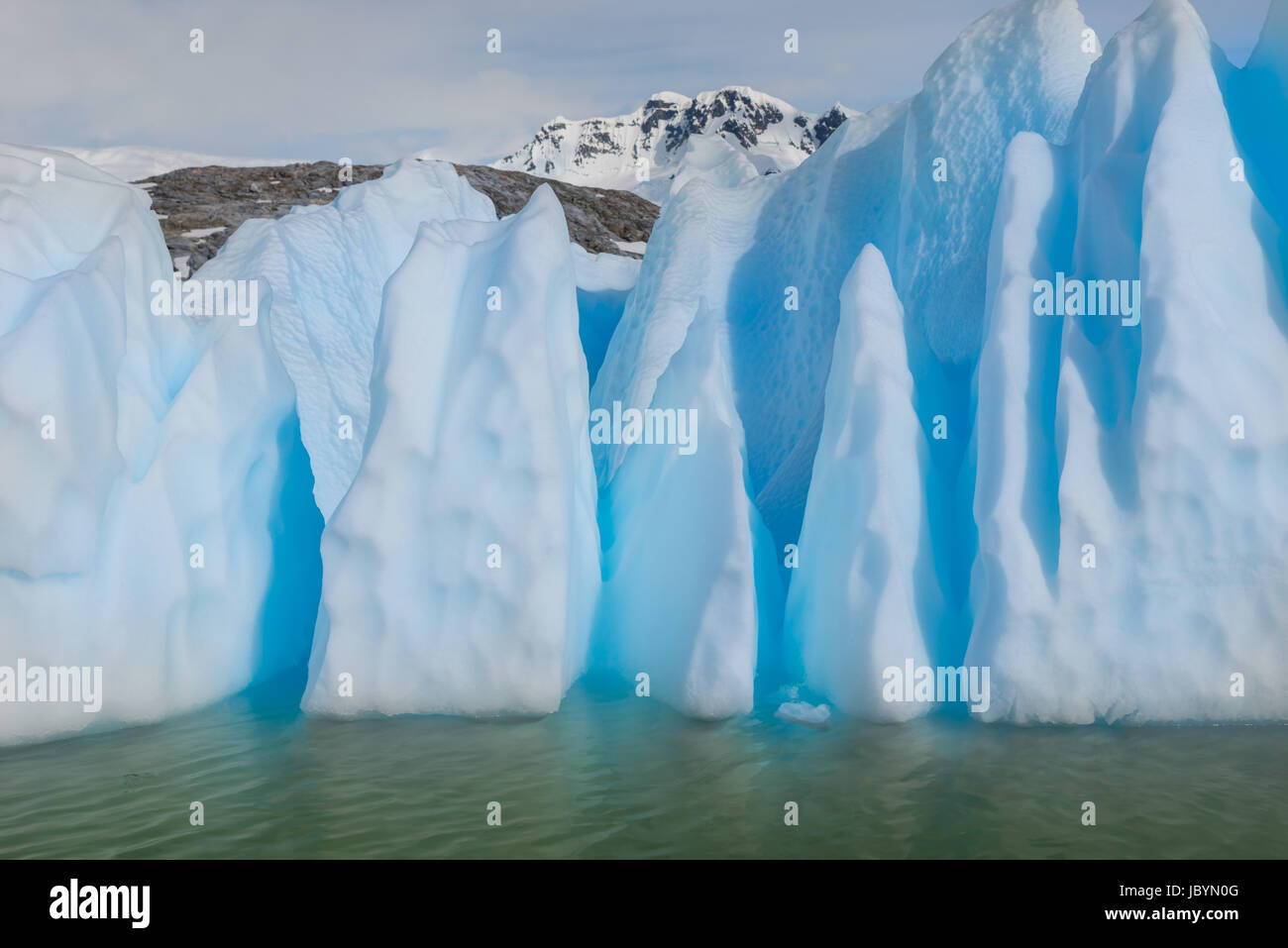 Blue shimmering beautiful iceberg in Antarctica Stock Photo - Alamy