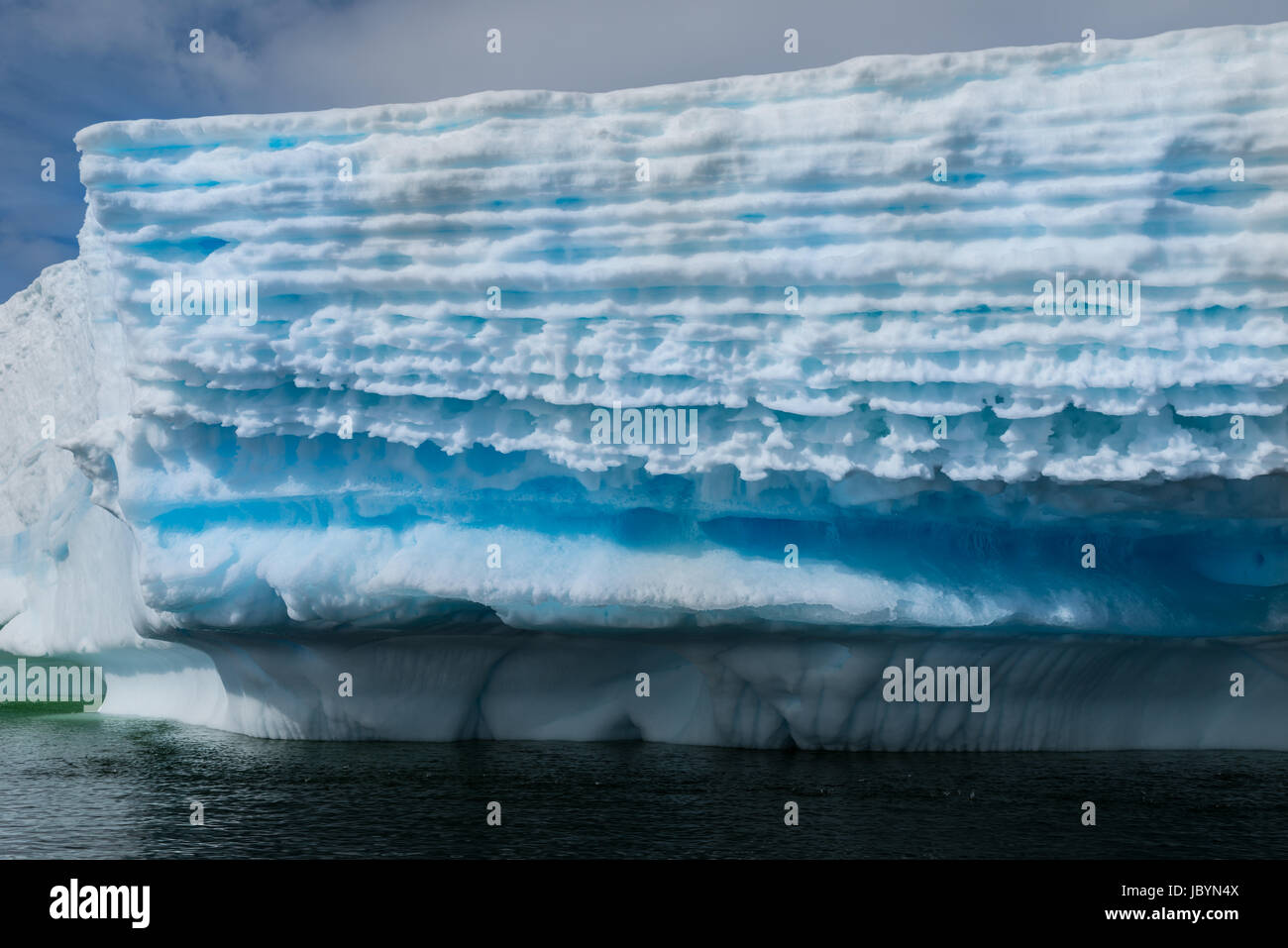 Blue shimmering beautiful iceberg in Antarctica Stock Photo - Alamy