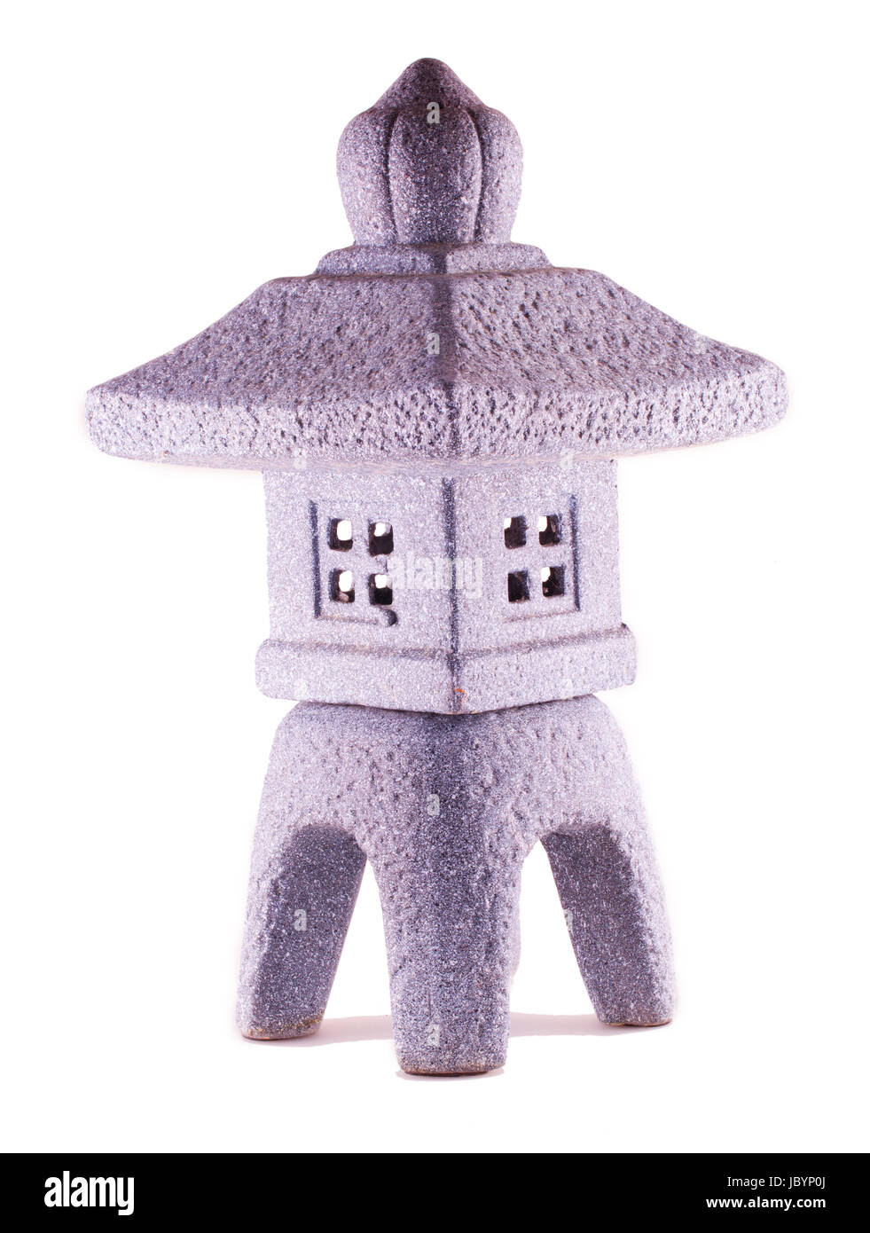 Small stone eastern temple with candles inside Stock Photo - Alamy