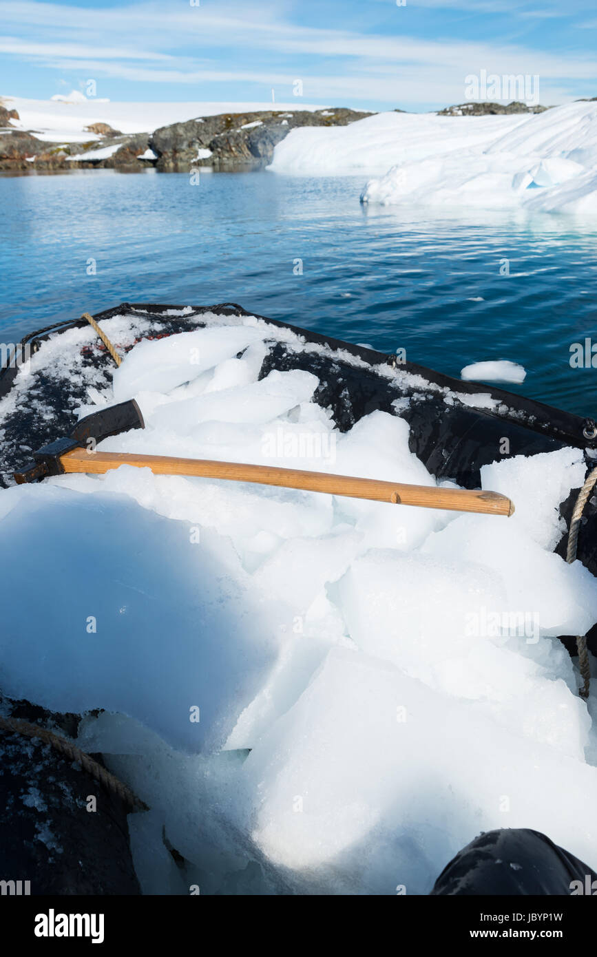 Getting ice from iceberg to make fresh water on expedition in ...