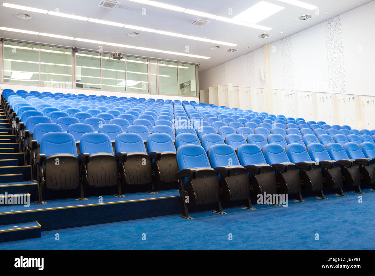 Interior of empty conference hall with blue velvet chairs Stock Photo ...