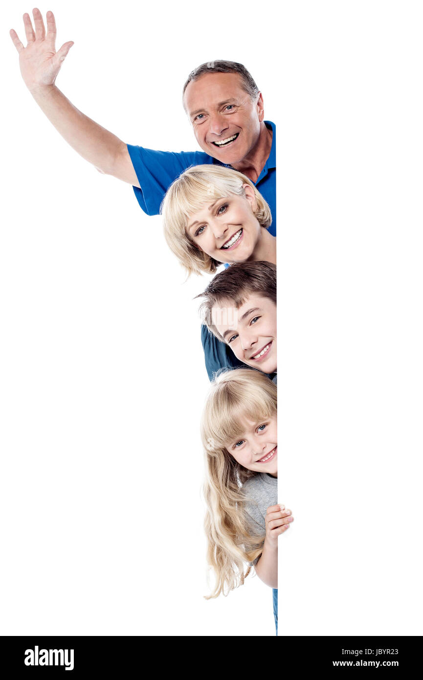 Smiling father raising his arm, family posing together Stock Photo - Alamy