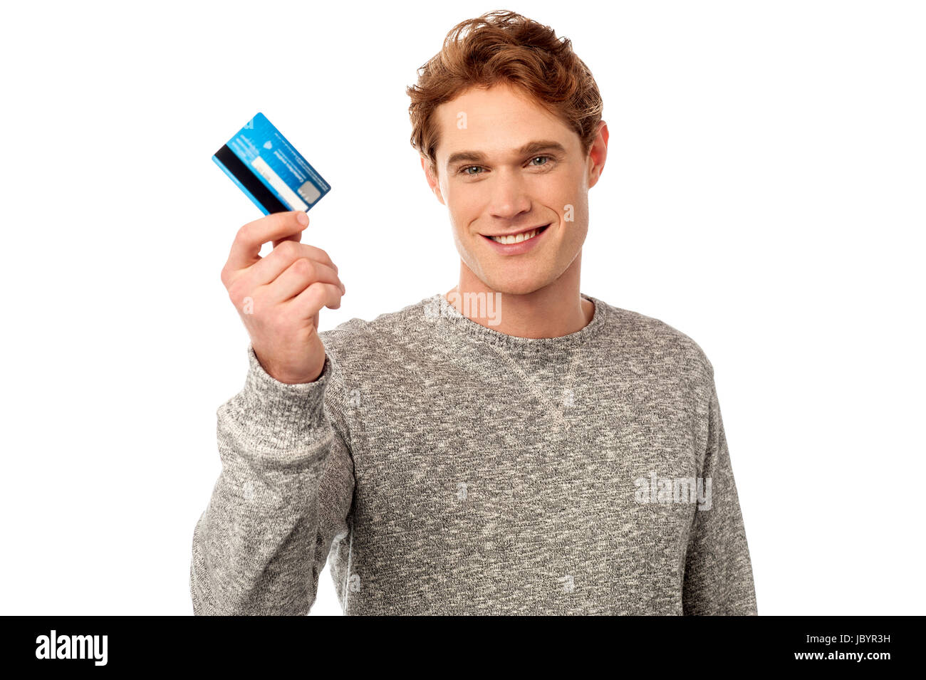 Handsome casual man holding his debit card Stock Photo - Alamy