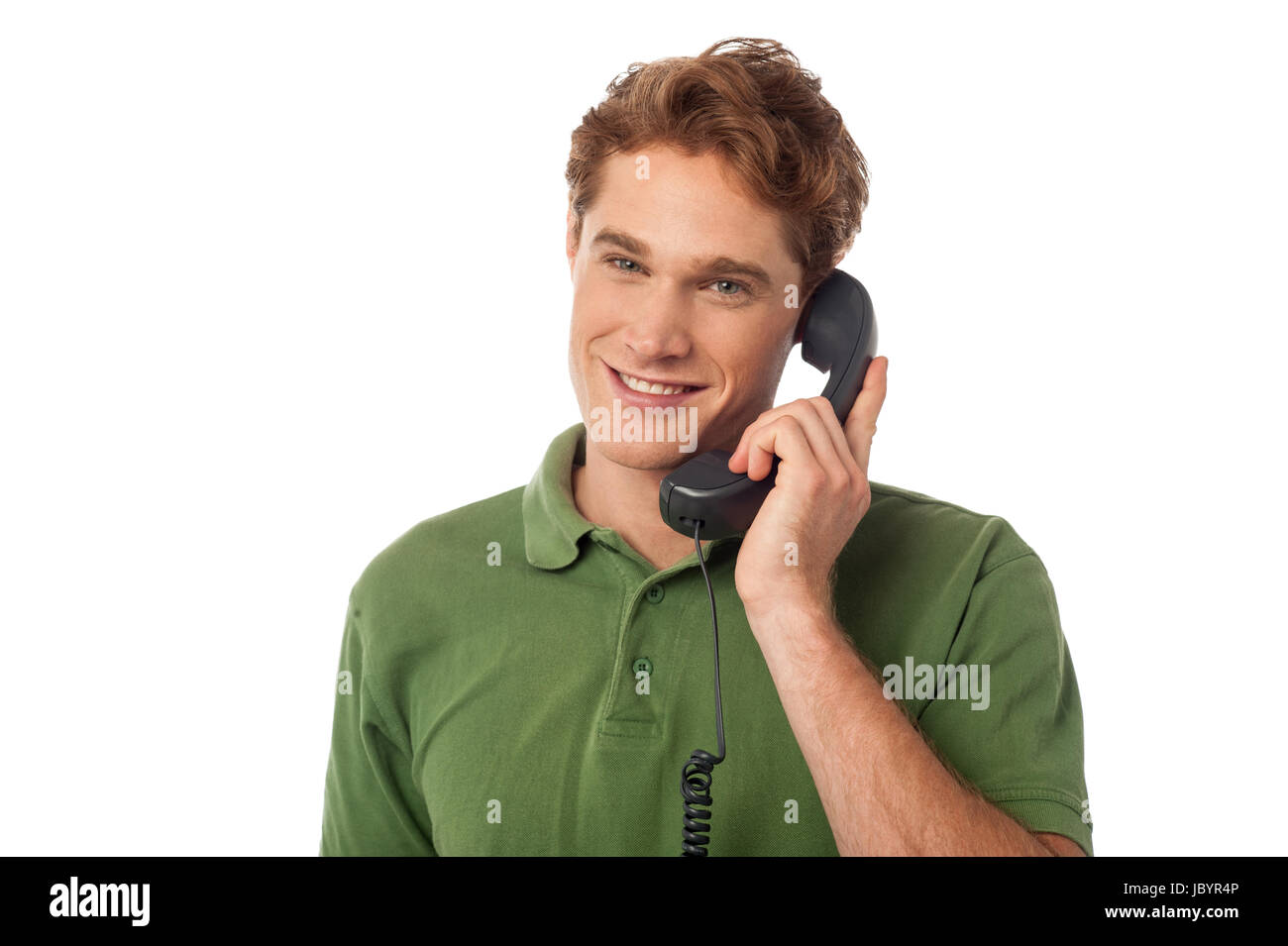 Handsome young man attending phone call Stock Photo - Alamy