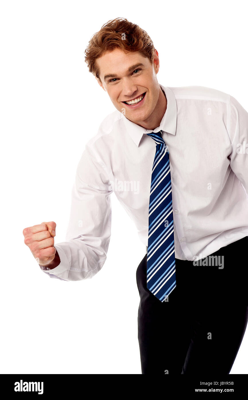 Excited business executive celebrating success Stock Photo - Alamy