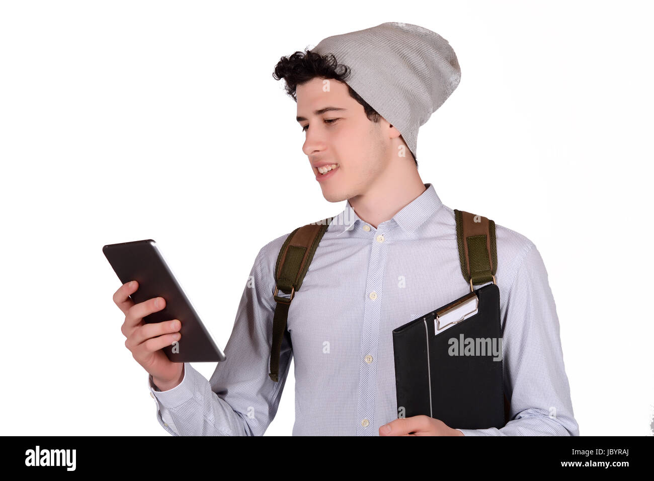 Portrait of young handsome man using tablet. Isolated white background ...