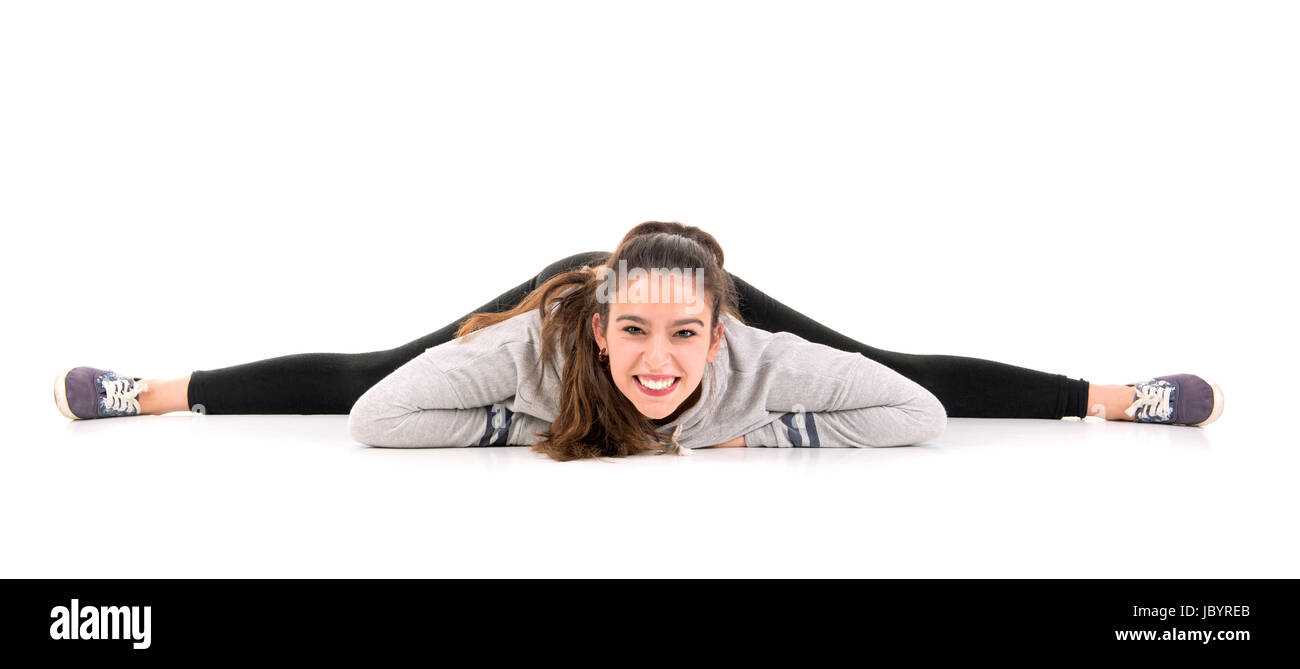 Girl doing exercises isolated in white Stock Photo - Alamy