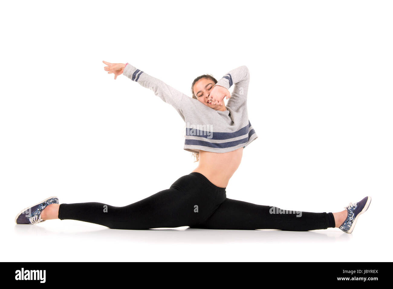 Girl doing exercises isolated in white Stock Photo - Alamy