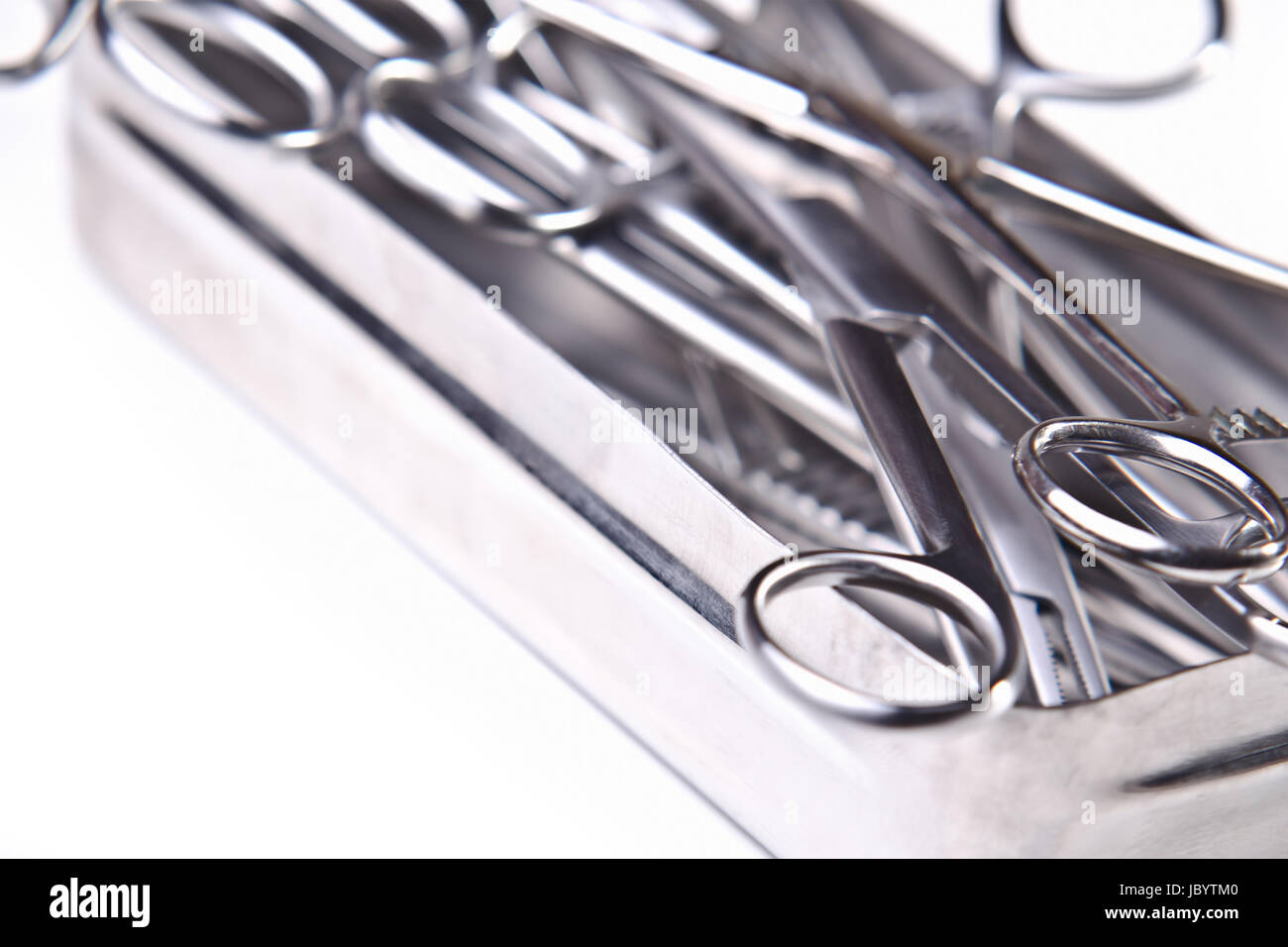 metallic shiny surgical instruments on white background Stock Photo - Alamy