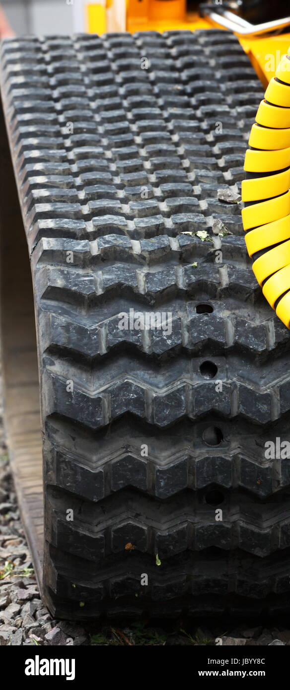 Tracks of small digger excavator heavy equipment industrial detail ...