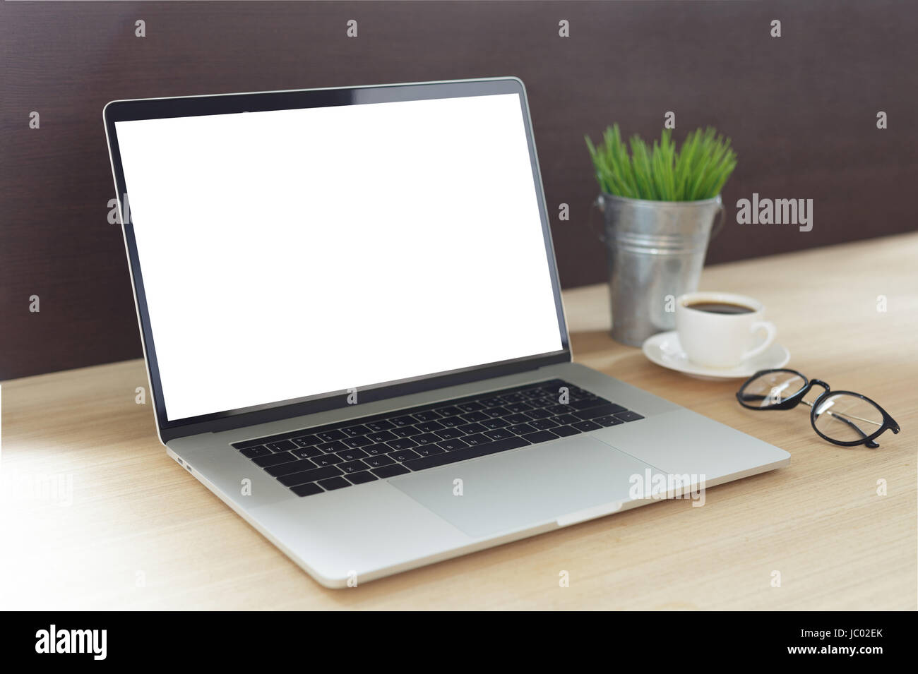 laptop computer on work desk showing white screen side view Stock Photo ...