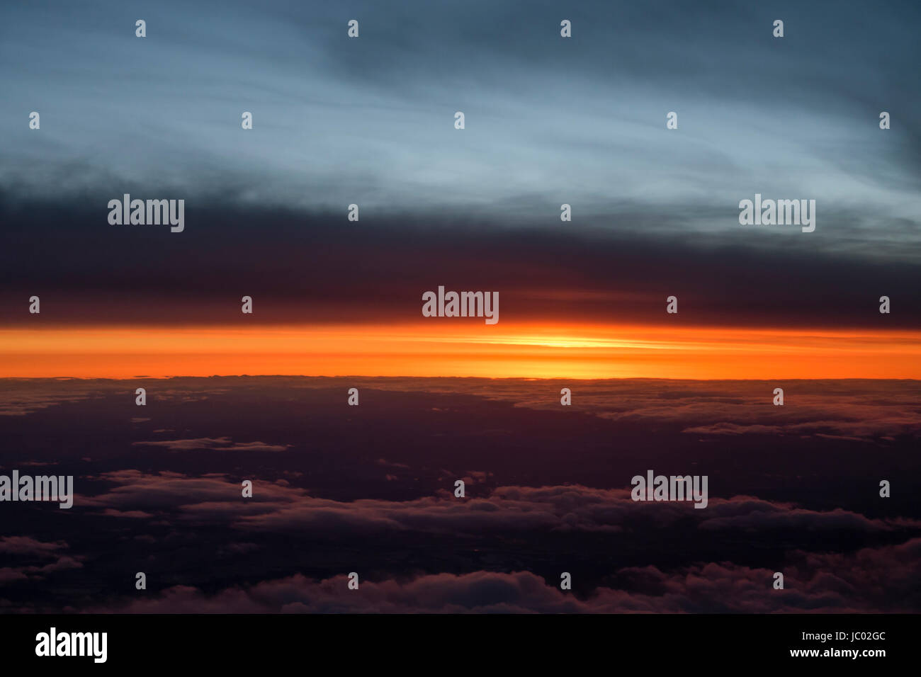 Aerial view of clouds and colorful sunrise for use as background or ...