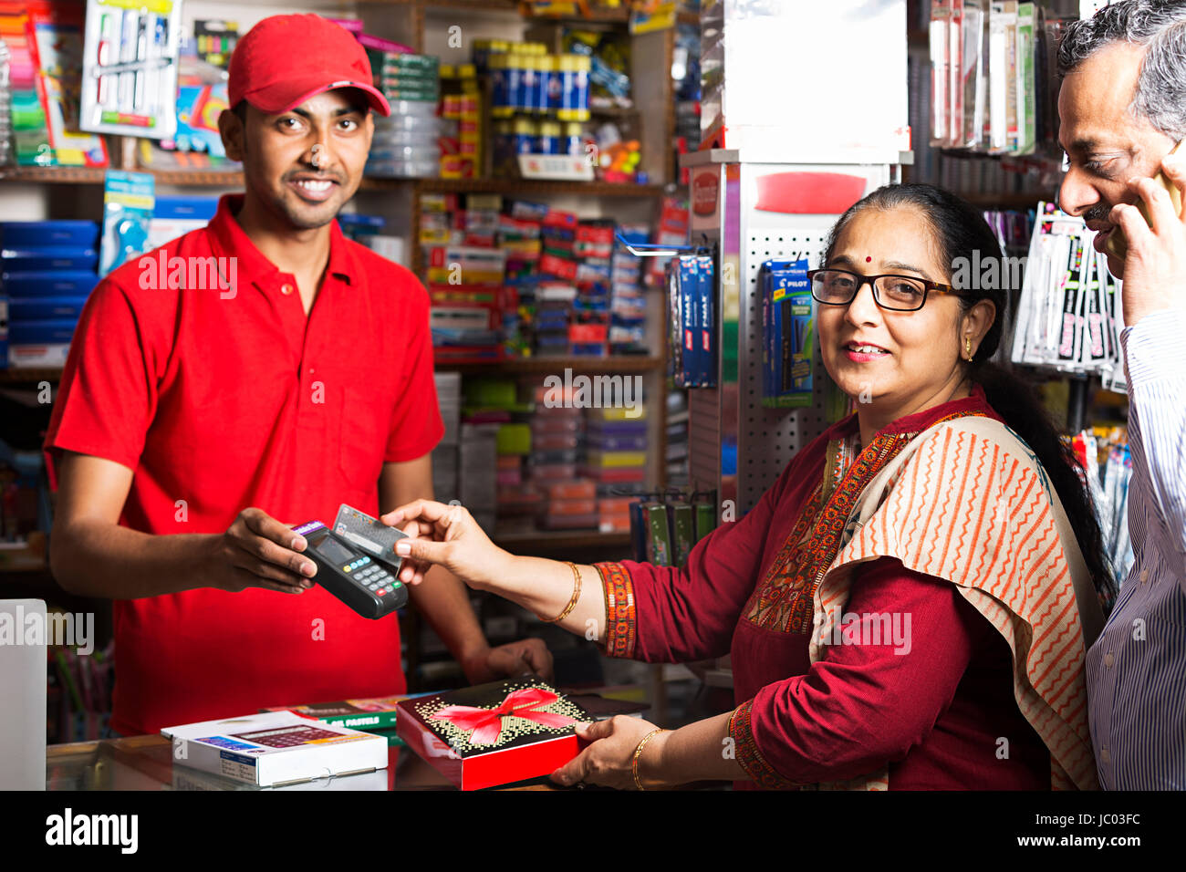 Shopkeeper And Customer Credit Card Swiping On Swipe Machine Product ...
