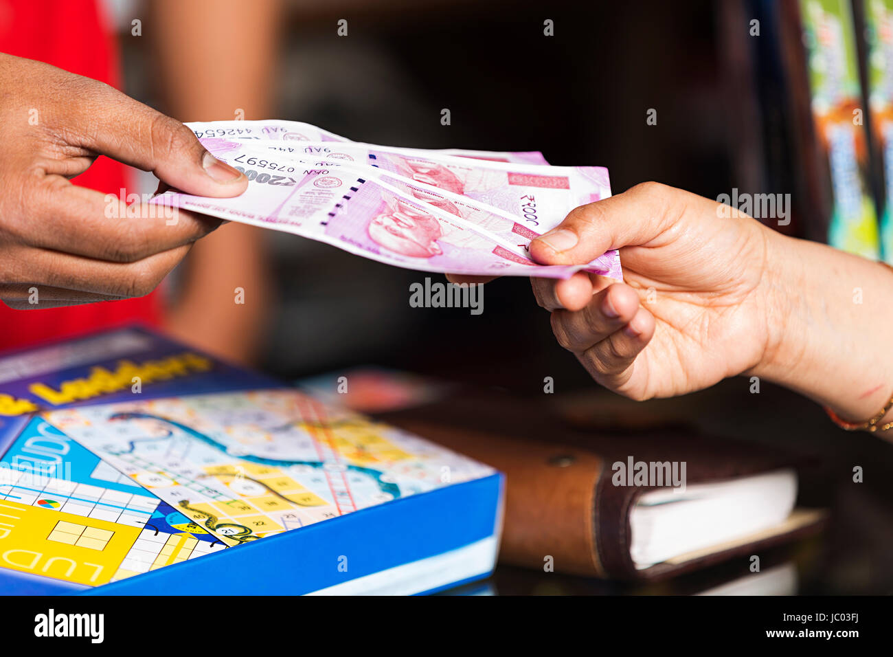 Shopkeeper And Customer Giving Rupees Money In Shop Stock Photo - Alamy