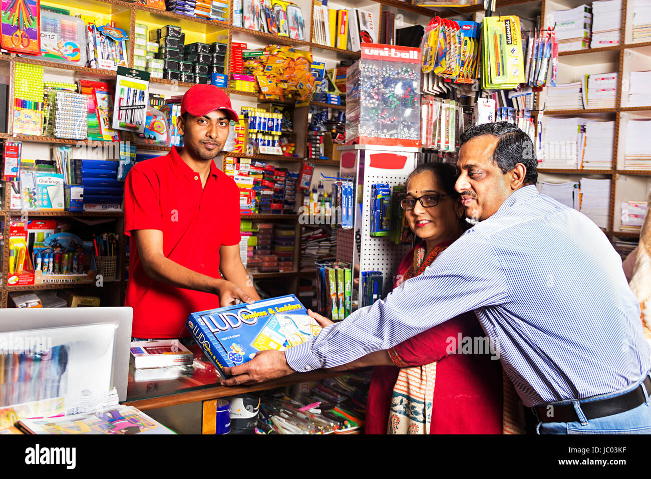 Indian Shopkeeper And Customer Buying Gift Receiving Stock Photo - Alamy