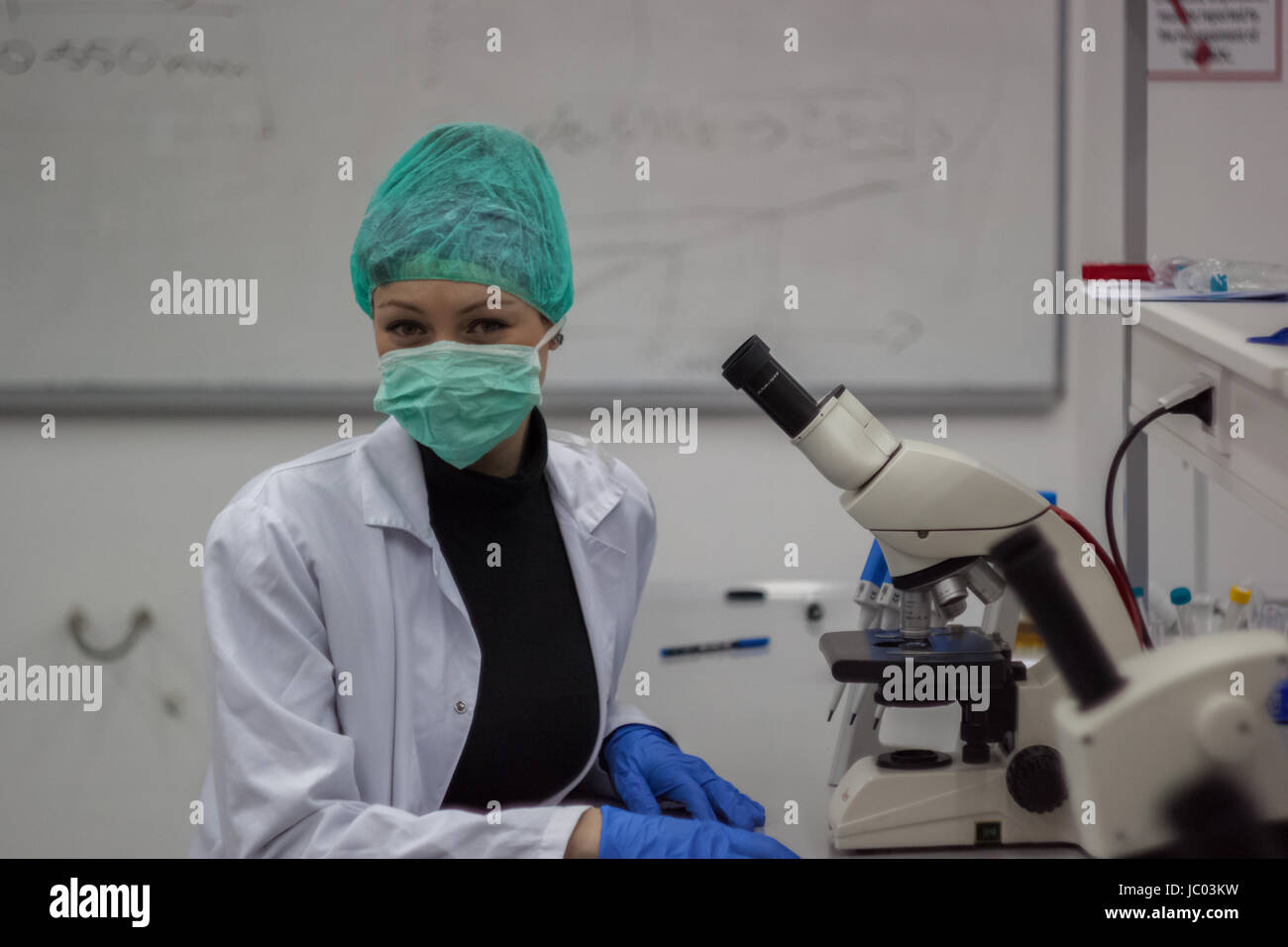 A beautiful female medical or scientific researcher or student in the ...