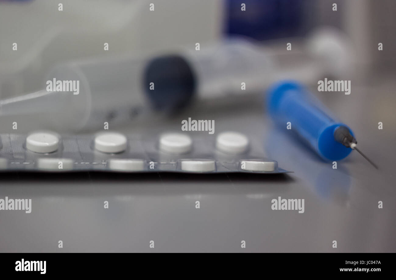 Drugs and medicaments on a desk Stock Photo - Alamy