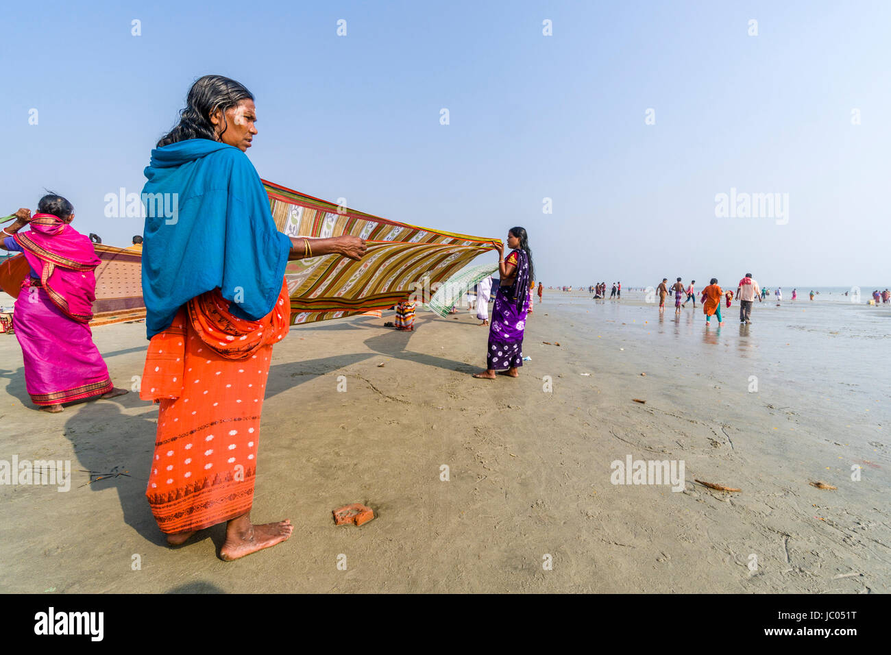 Women are drying her saris on the beach of Ganga Sagar, celebrating ...