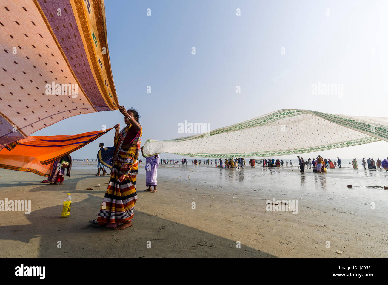Women are drying her saris on the beach of Ganga Sagar, celebrating ...