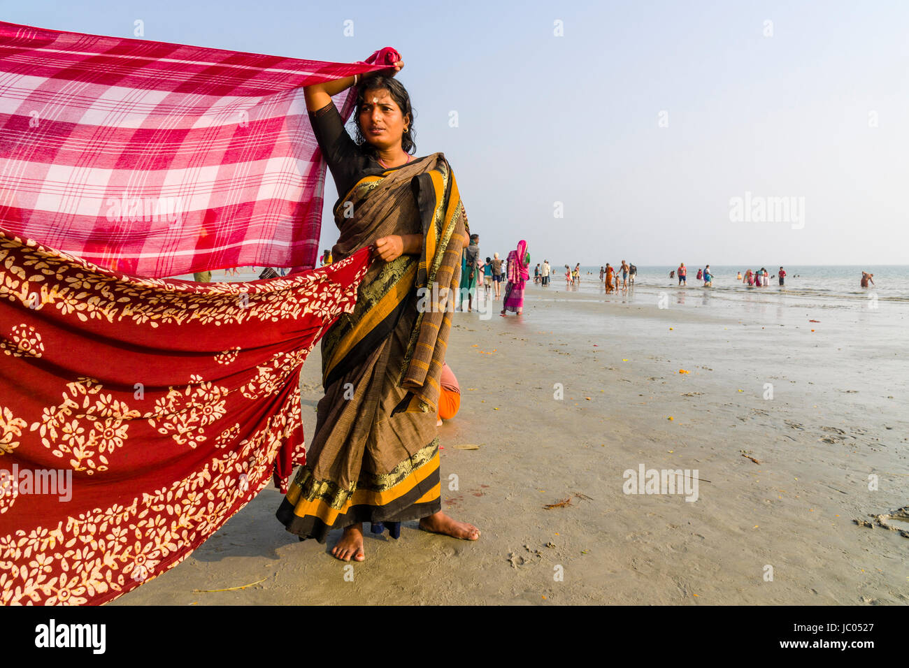 Women are drying her saris on the beach of Ganga Sagar, celebrating ...