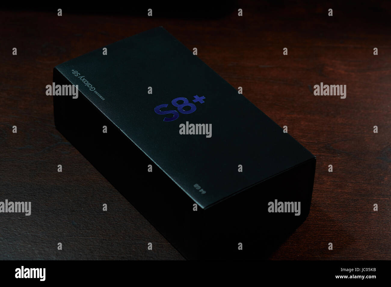 New york, USA - June 12, 2017: New samsung s8 plus box on dark brown ...