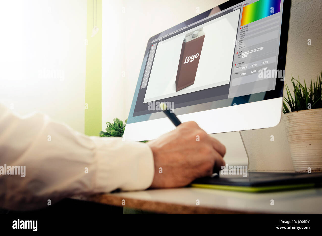 packaging designer working. All screen graphics are made up Stock Photo ...