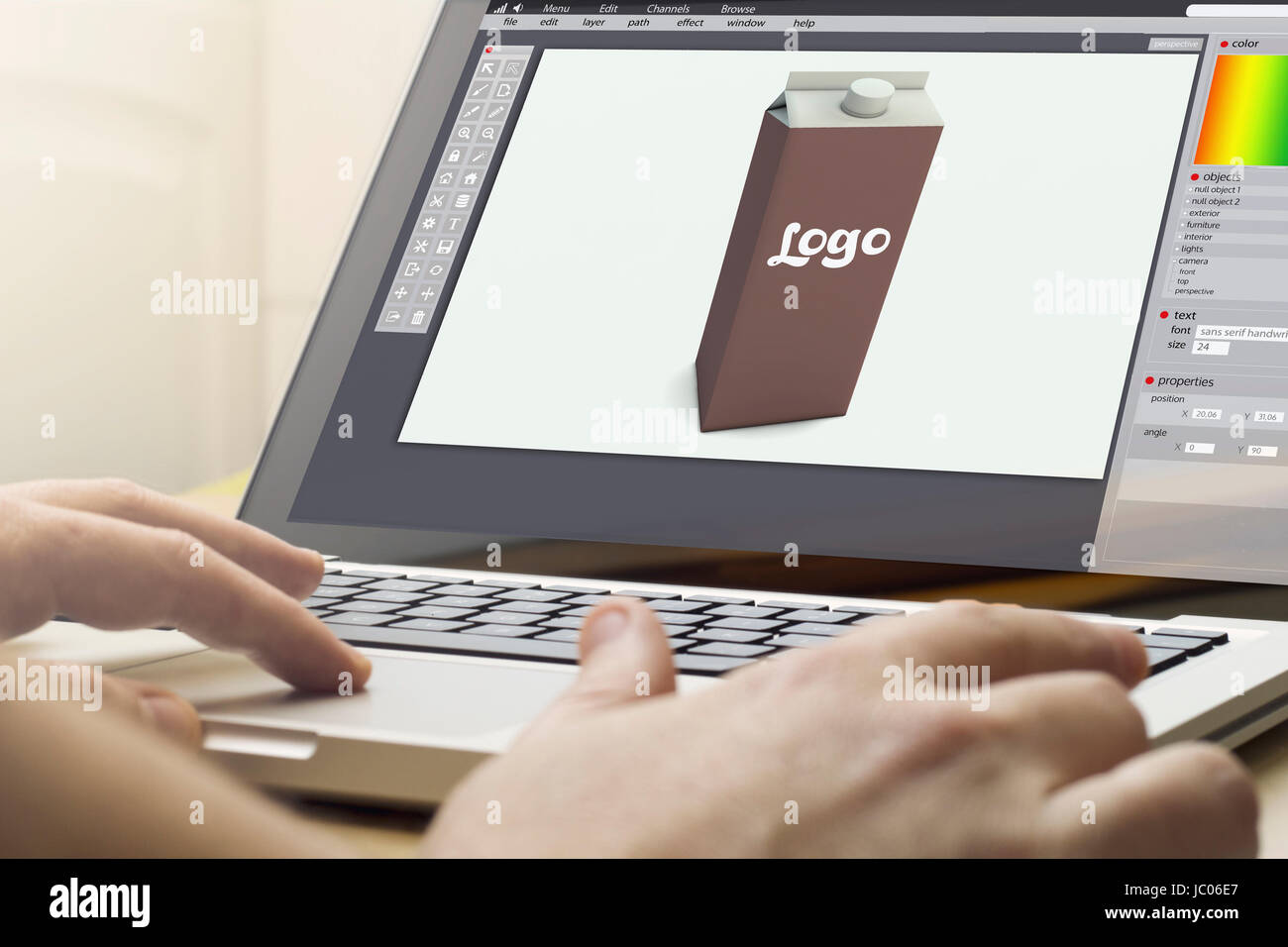 packaging design concept: man using a laptop with packaging design ...