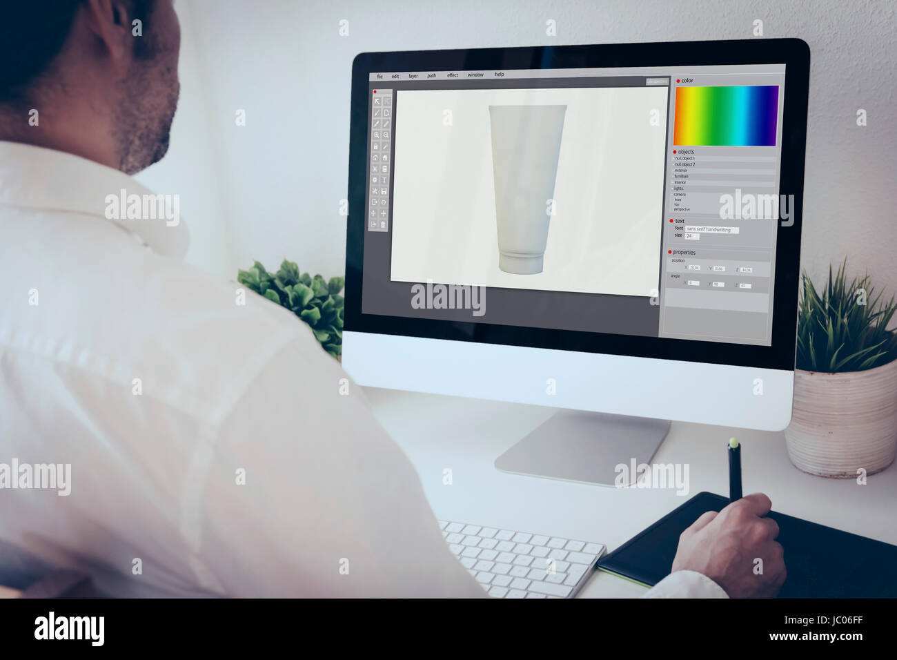 freelance product designer working with computer and graphic pen Stock ...