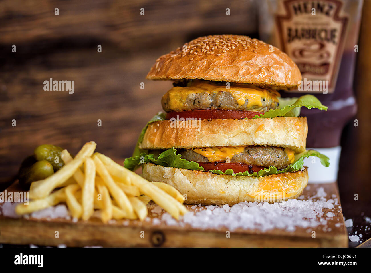 Homemade Maxi Burger with grilled beef steak, lettuce, cheese, tomato ...