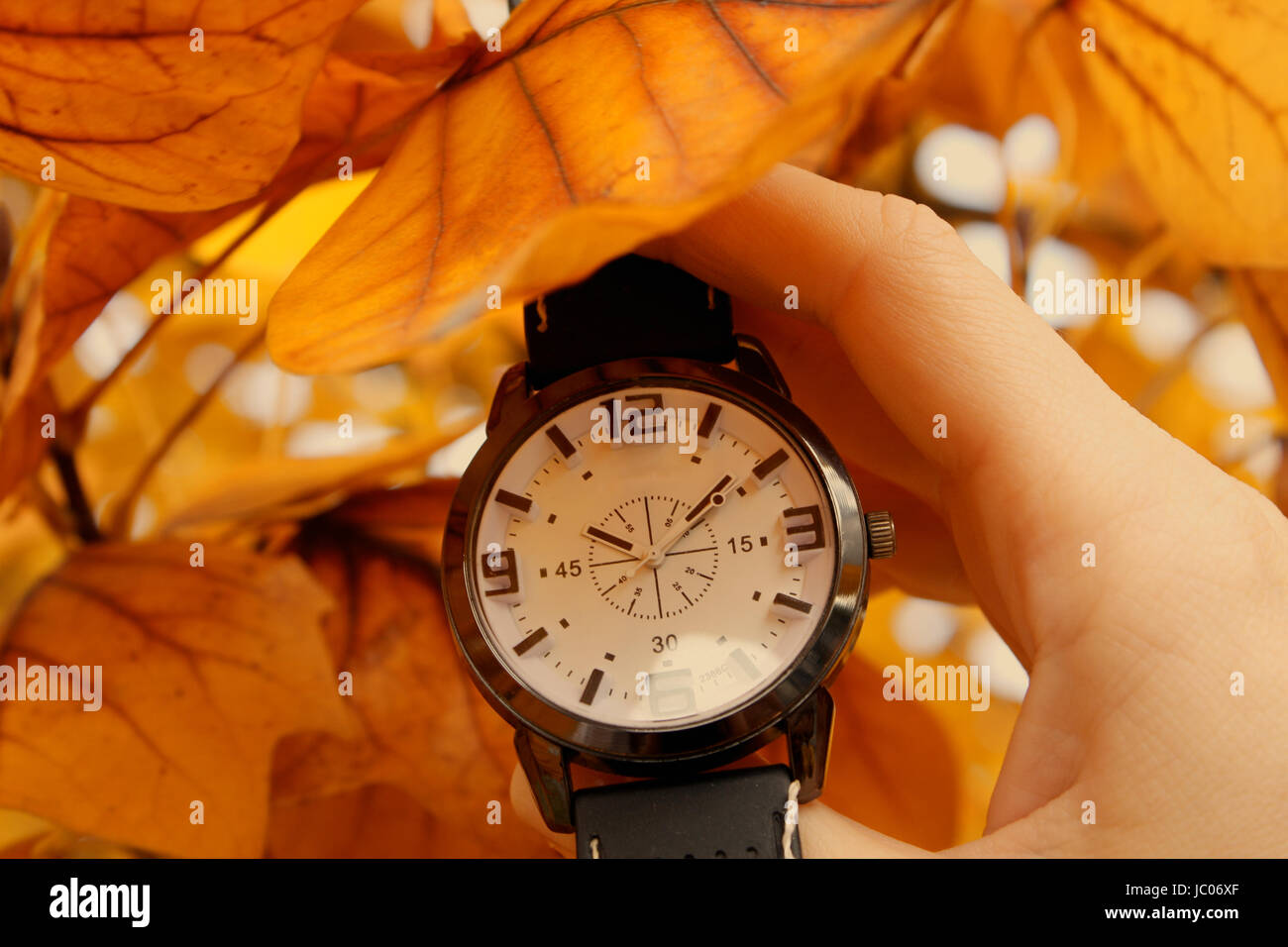 Autumn come with Clock isolated Stock Photo - Alamy