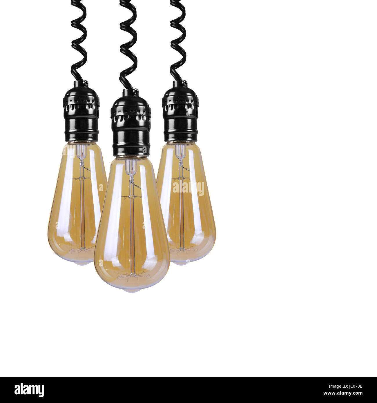 Three Incandescent light bulb hangs down on top on a white background ...