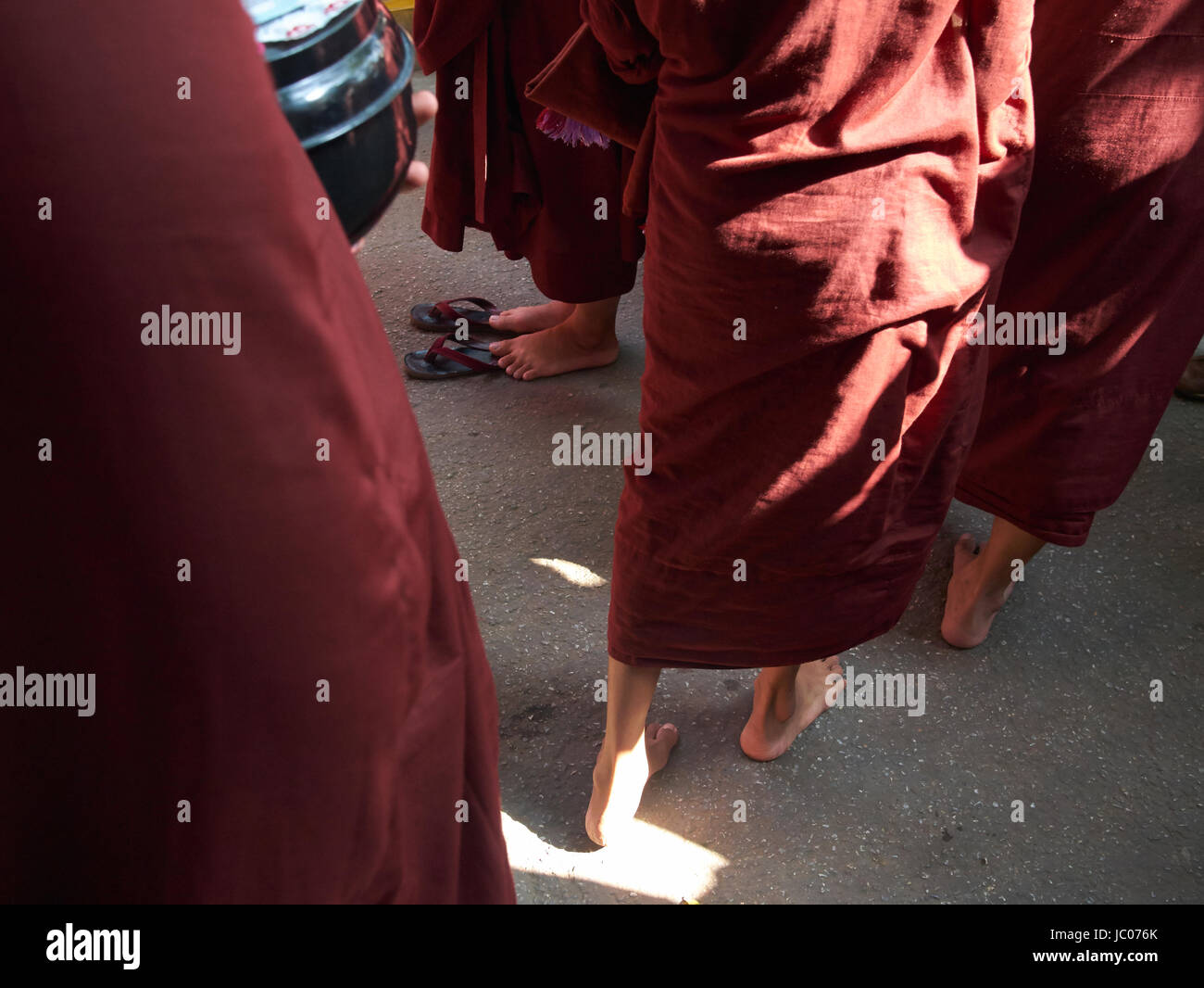 Monk's feet during alms collection Myanmar Stock Photo - Alamy
