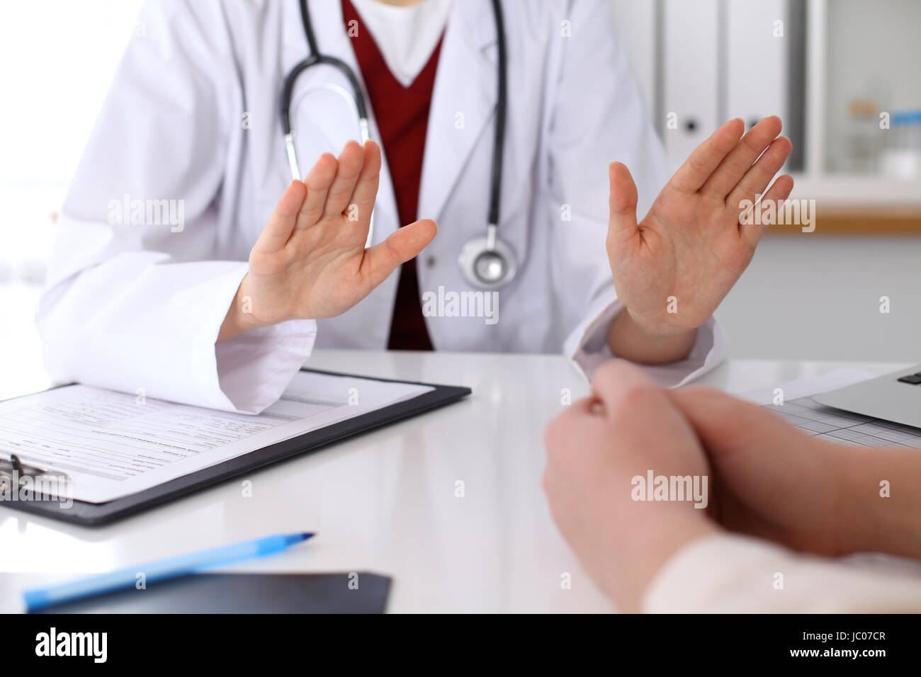 Hand of doctor reassuring her female patient Stock Photo - Alamy