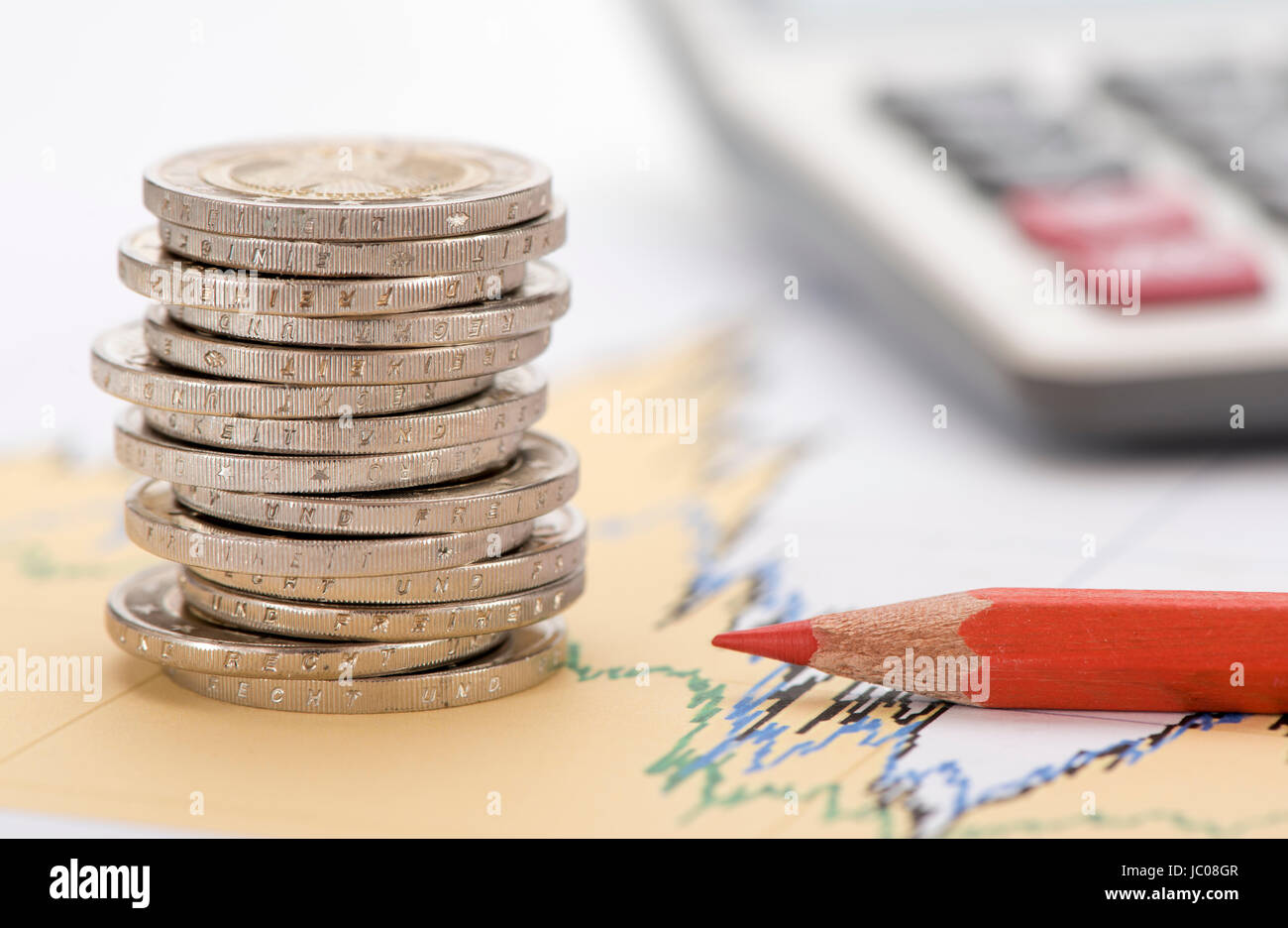 stacked euro coins on table sheet with chart of exchange market Stock ... stacked euro coins on table sheet with chart of exchange market Stock ...