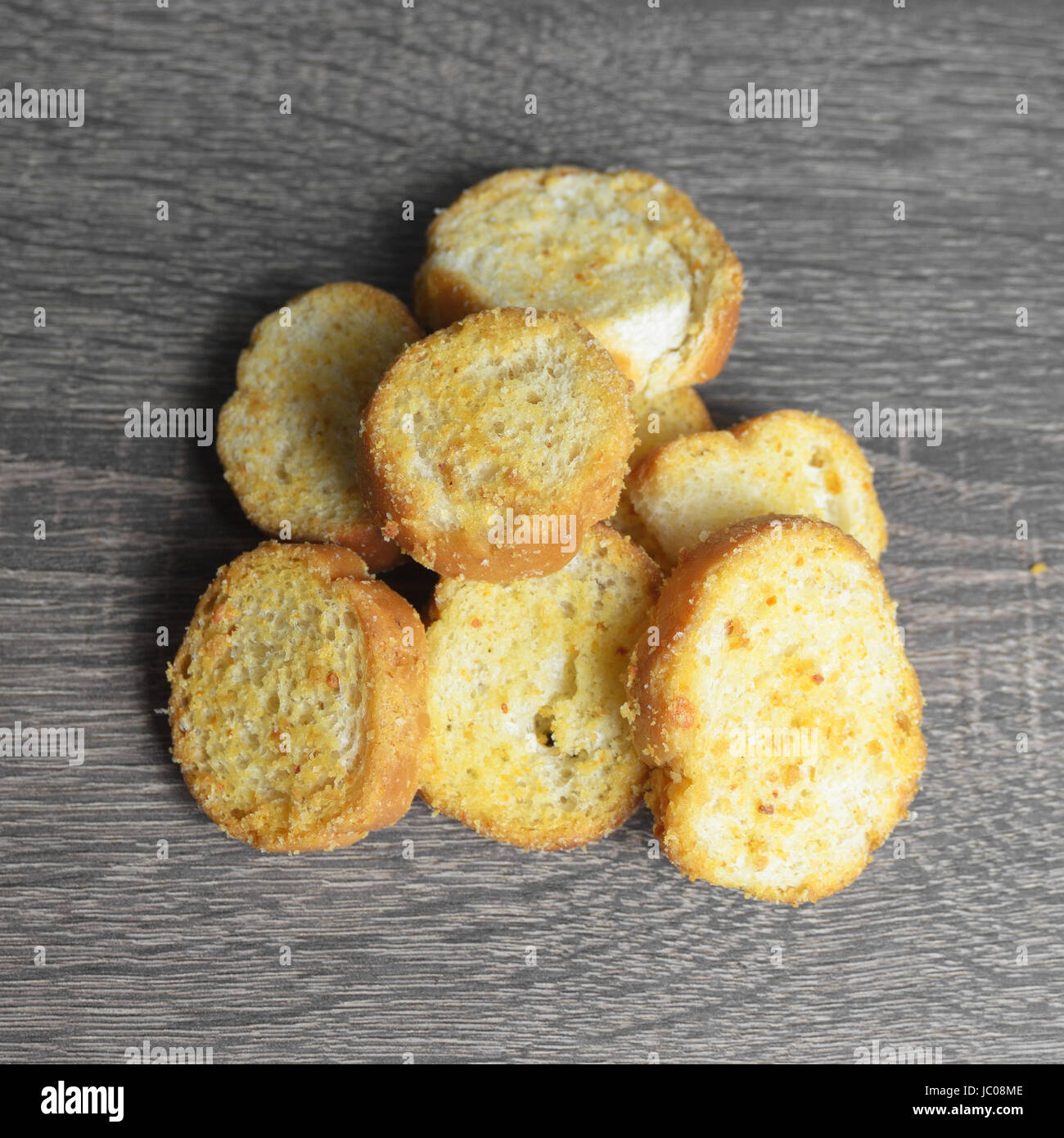 Toast in small rounded pieces. Toasts roasted with butter Stock Photo ...