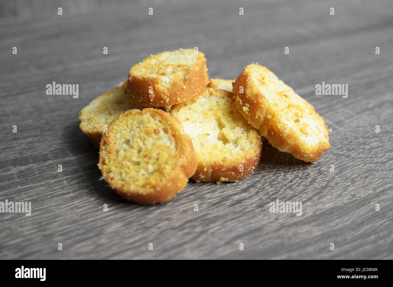 Toast in small rounded pieces. Toasts roasted with butter Stock Photo ...