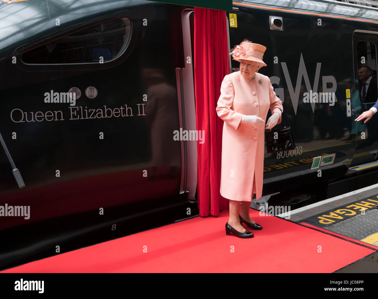 Queen Elizabeth II unveils the new livery of the train as she and the ...