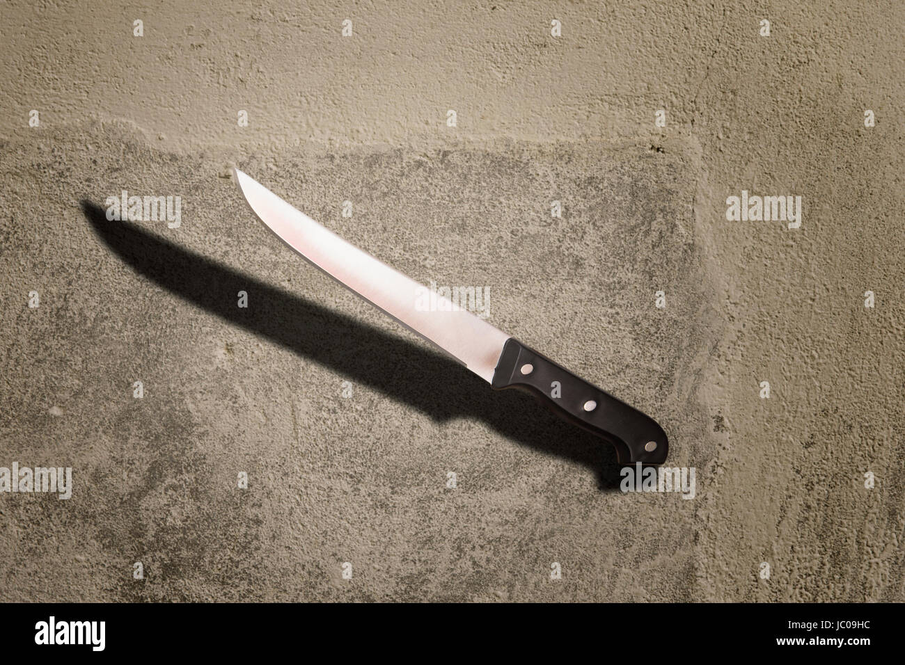 Kitchen knife and shadow over a textured old background Stock Photo - Alamy