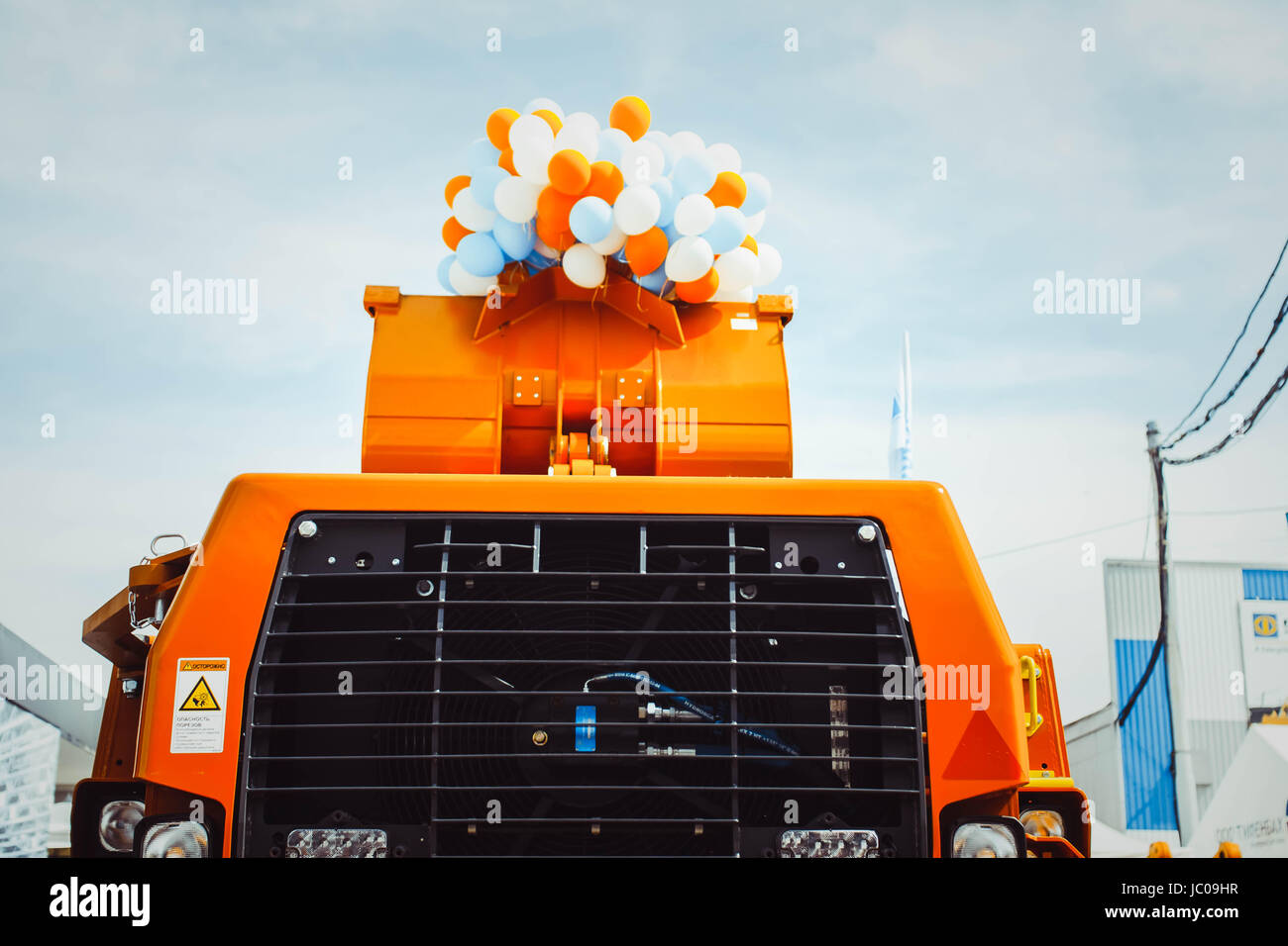 The hydraulic tractor is yellow. Crawler bulldozer at the exhibition ...