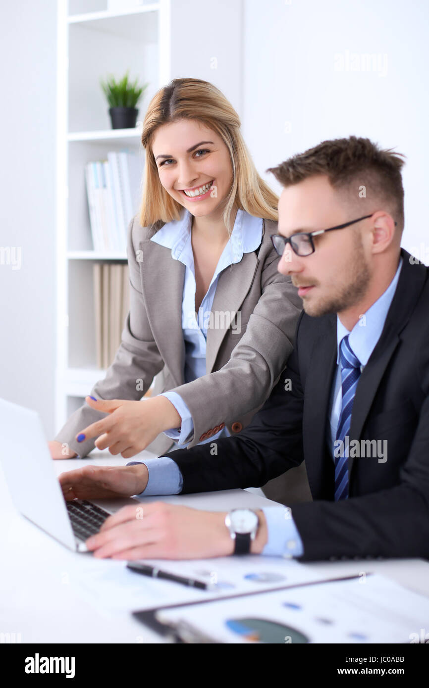 Two successful business partners working at meeting in office Stock ...