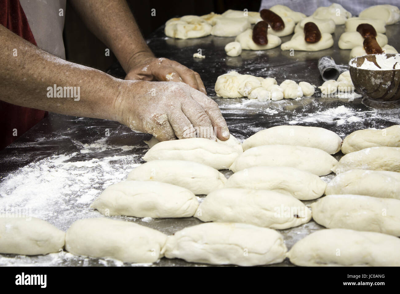 Man kneading bread in bakery, crafts and work Stock Photo - Alamy