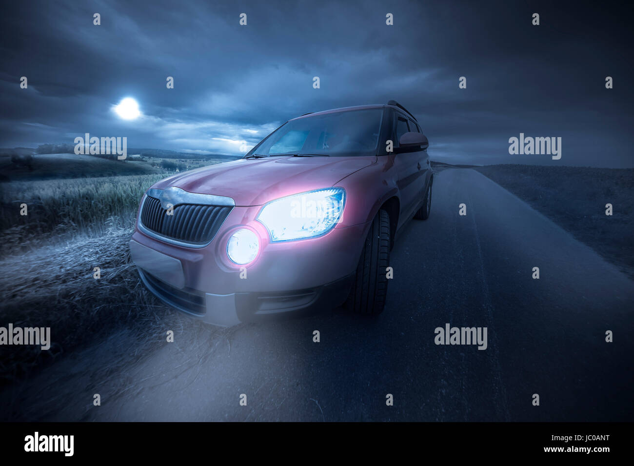 At night car drives on remote street Stock Photo - Alamy