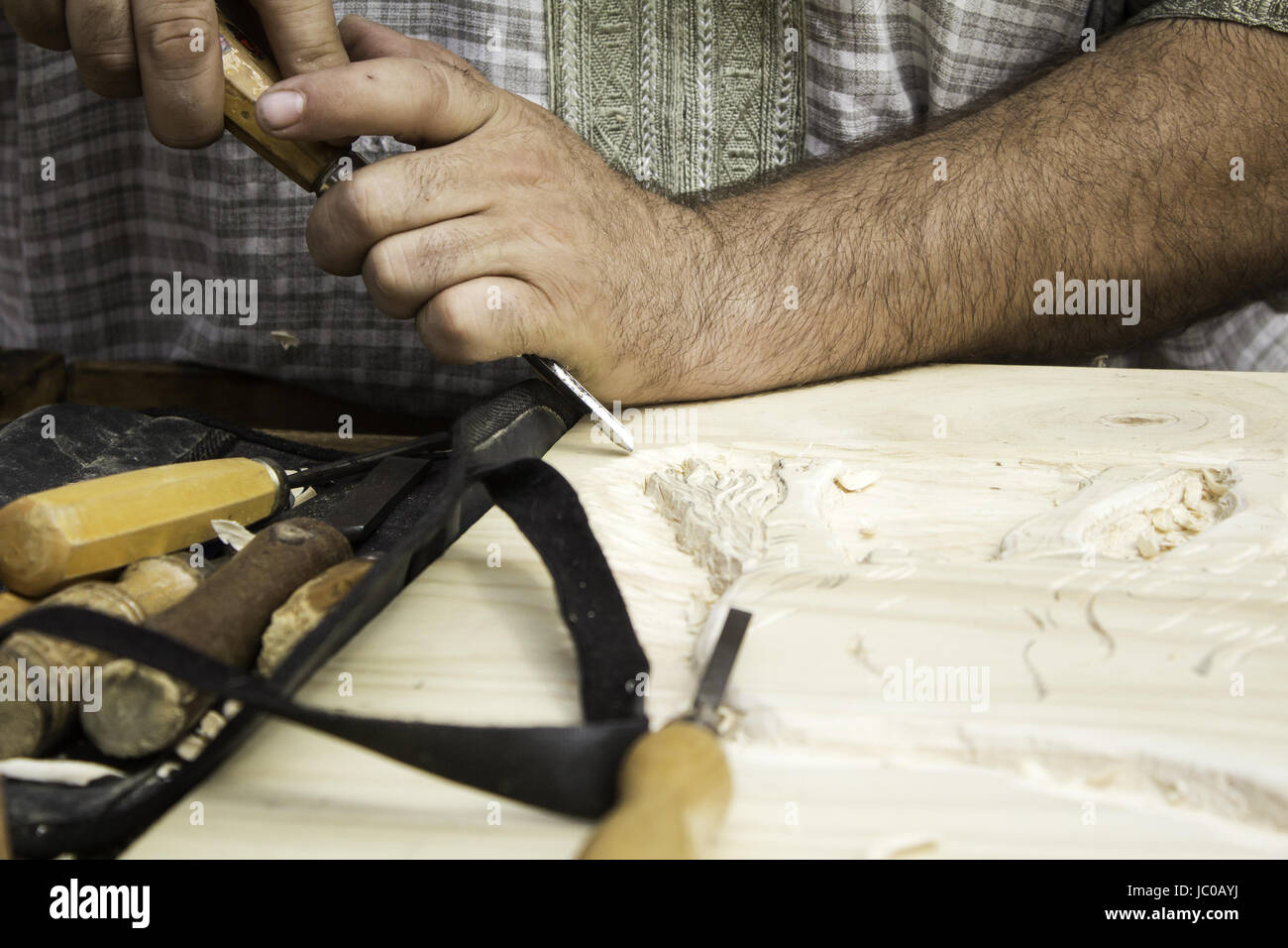 Man carving wooden board, work and crafts Stock Photo - Alamy