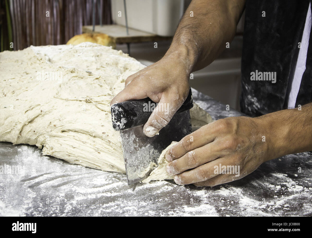 Man kneading bread in bakery, crafts and work Stock Photo - Alamy