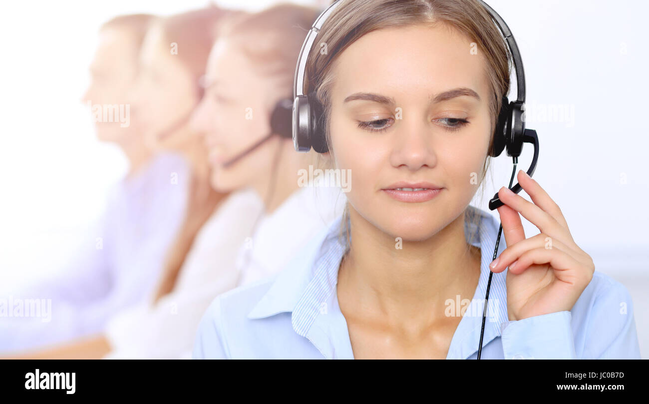 Young beautiful business woman in headset. Call center operator Stock ...