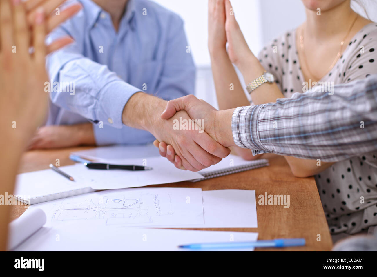 Business people handshaking finishing up meeting, close up Stock Photo ...
