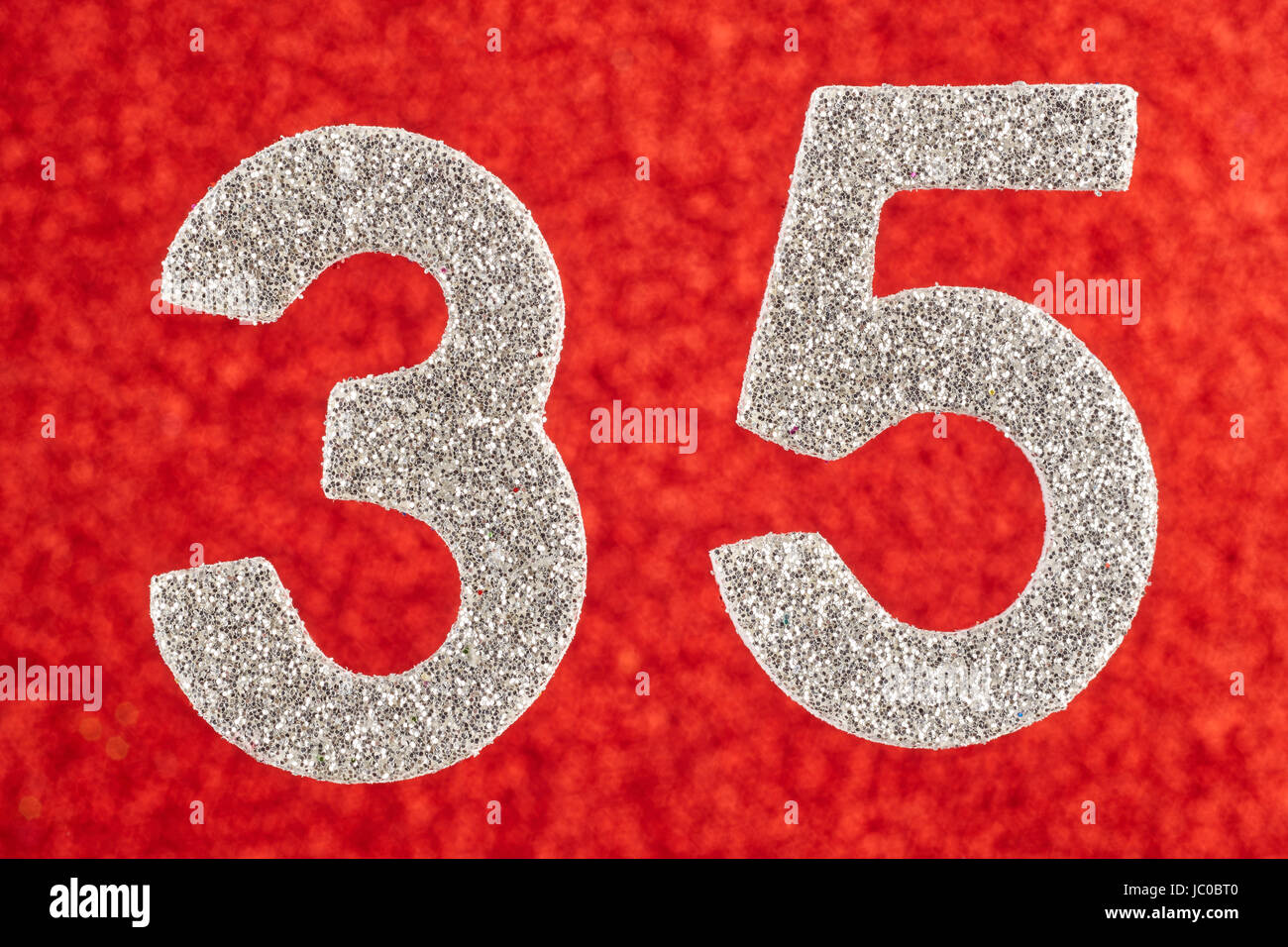 Number thirty-five silver color over a red background. Anniversary ...
